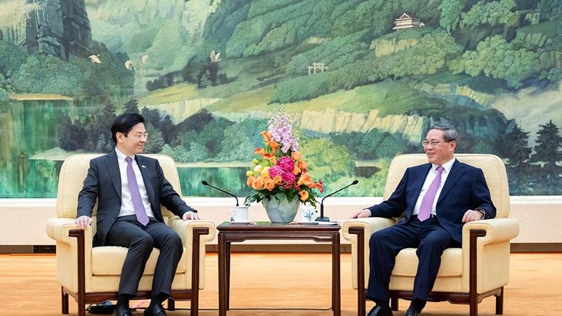 Li pledges to advance ties with Singapore