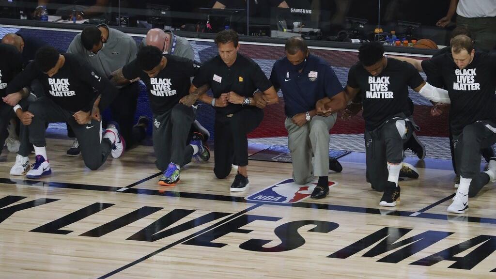 NBA players protest racial injustice as league returns to action