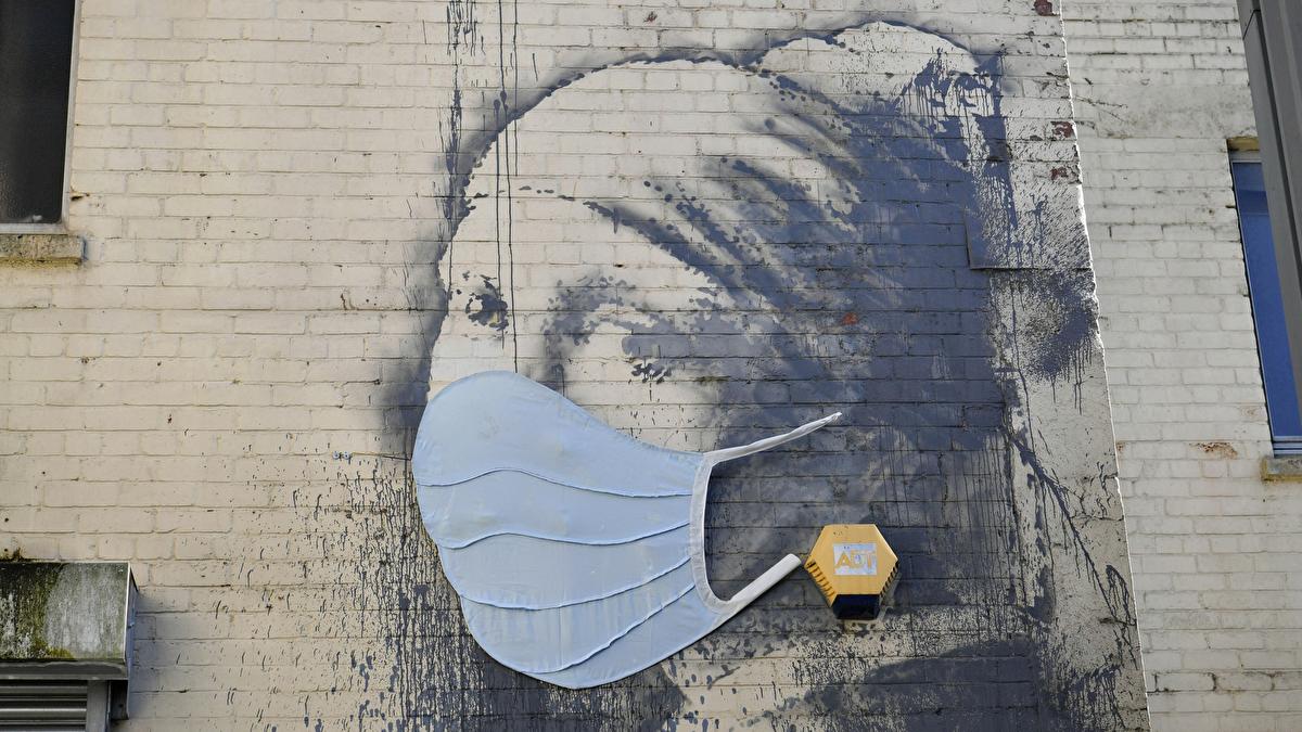 Banksy's Girl with a Pierced Eardrum gains a face mask