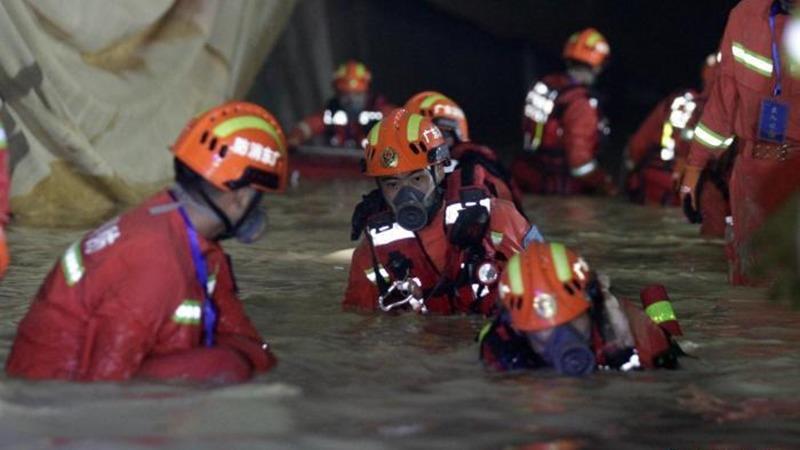 Search continues for 11 trapped in tunnel