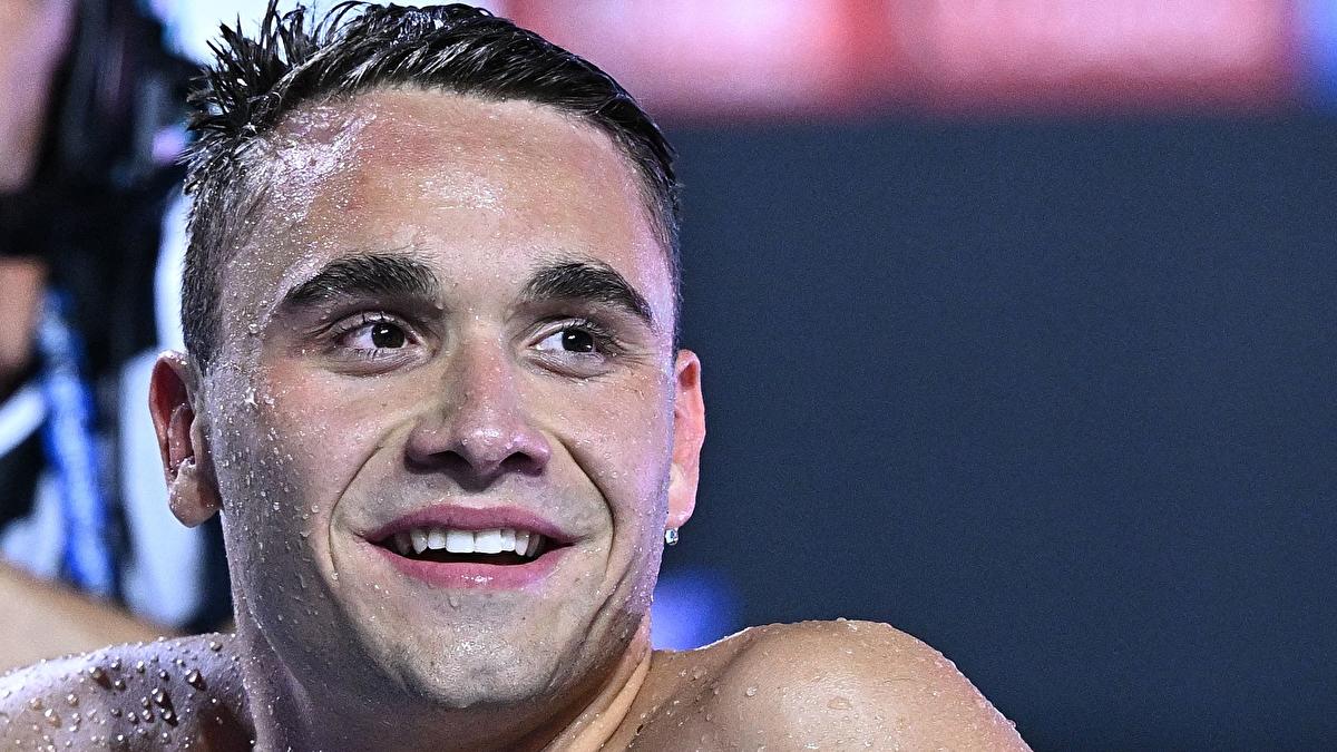 Milak thrills home fans with world-record dash to glory