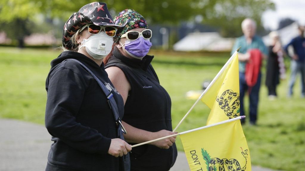 US protesters demand end to restrictions