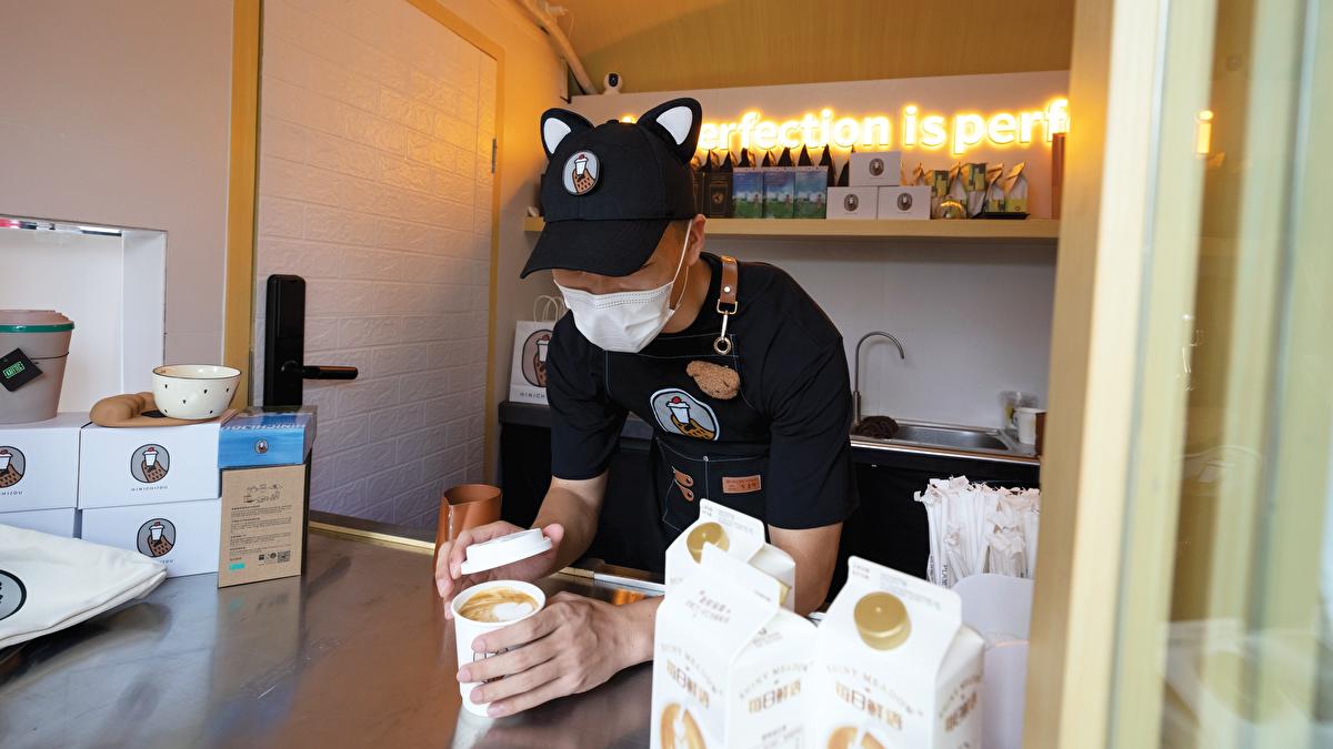 Blind twins realize barista dream