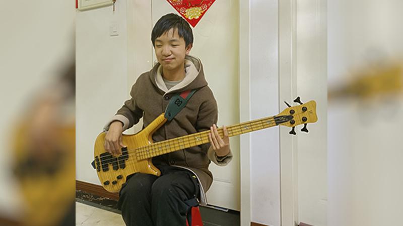 Blinded in attack, boy finds joy in bass