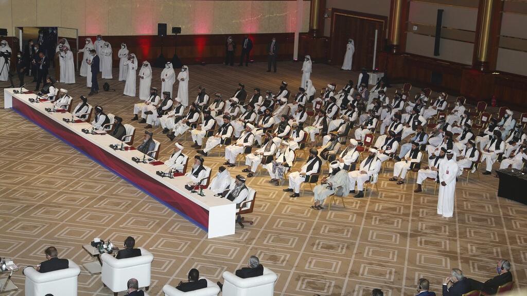 Afghan peace talks should rotate among countries, envoy says