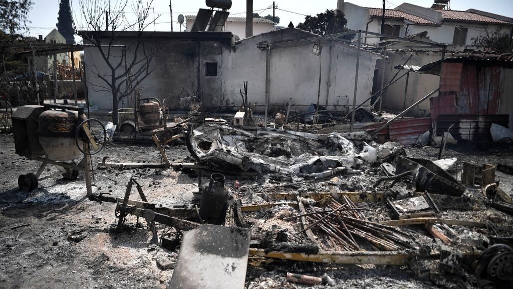 Thousands flee in Greece as fires sweep through Mediterranean